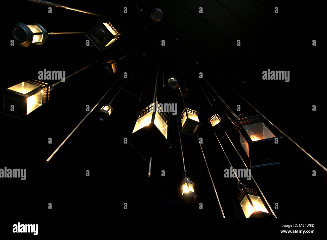 pile of vintage lamp hanging on ceiling with turn on light bulb Stock ...