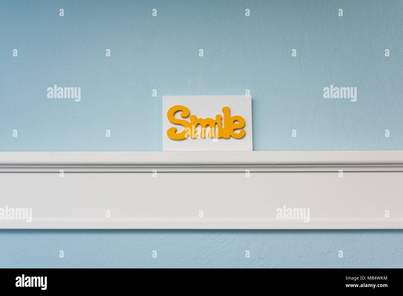 White block with yellow word Smile Stock Photo - Alamy