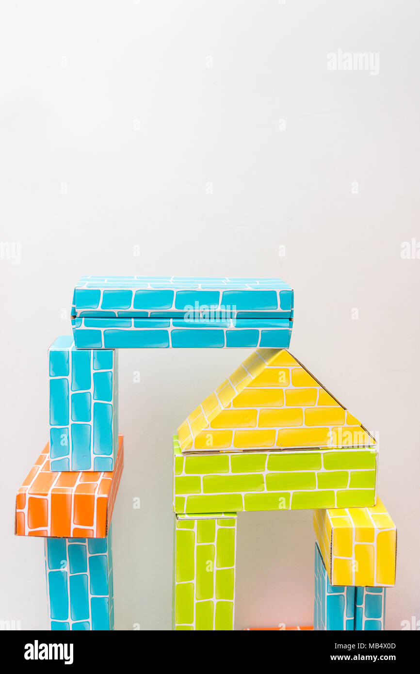 Kids play bricks, multicolored Stock Photo - Alamy