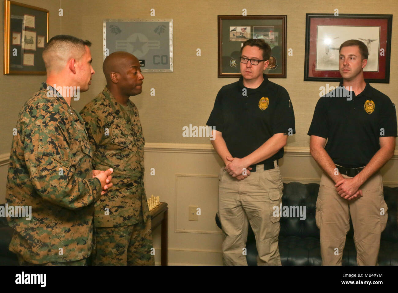 Col. Timothy Miller and Sgt. Maj. Derrick Mays congratulate police ...