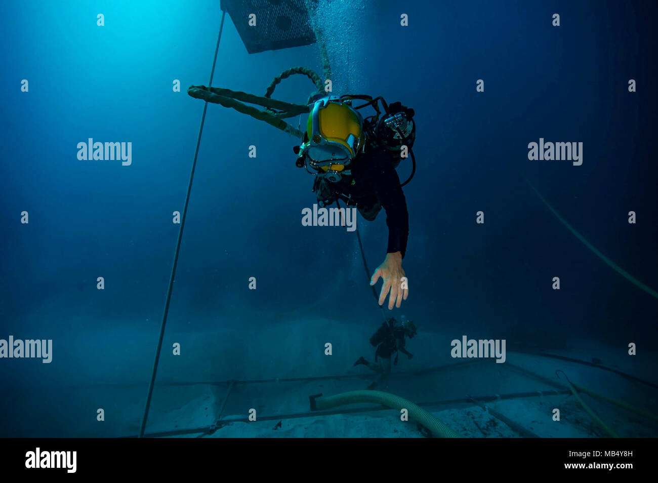 Navy Diver 2nd Class Jordan McElyea, left, and Navy Diver 1st Class ...