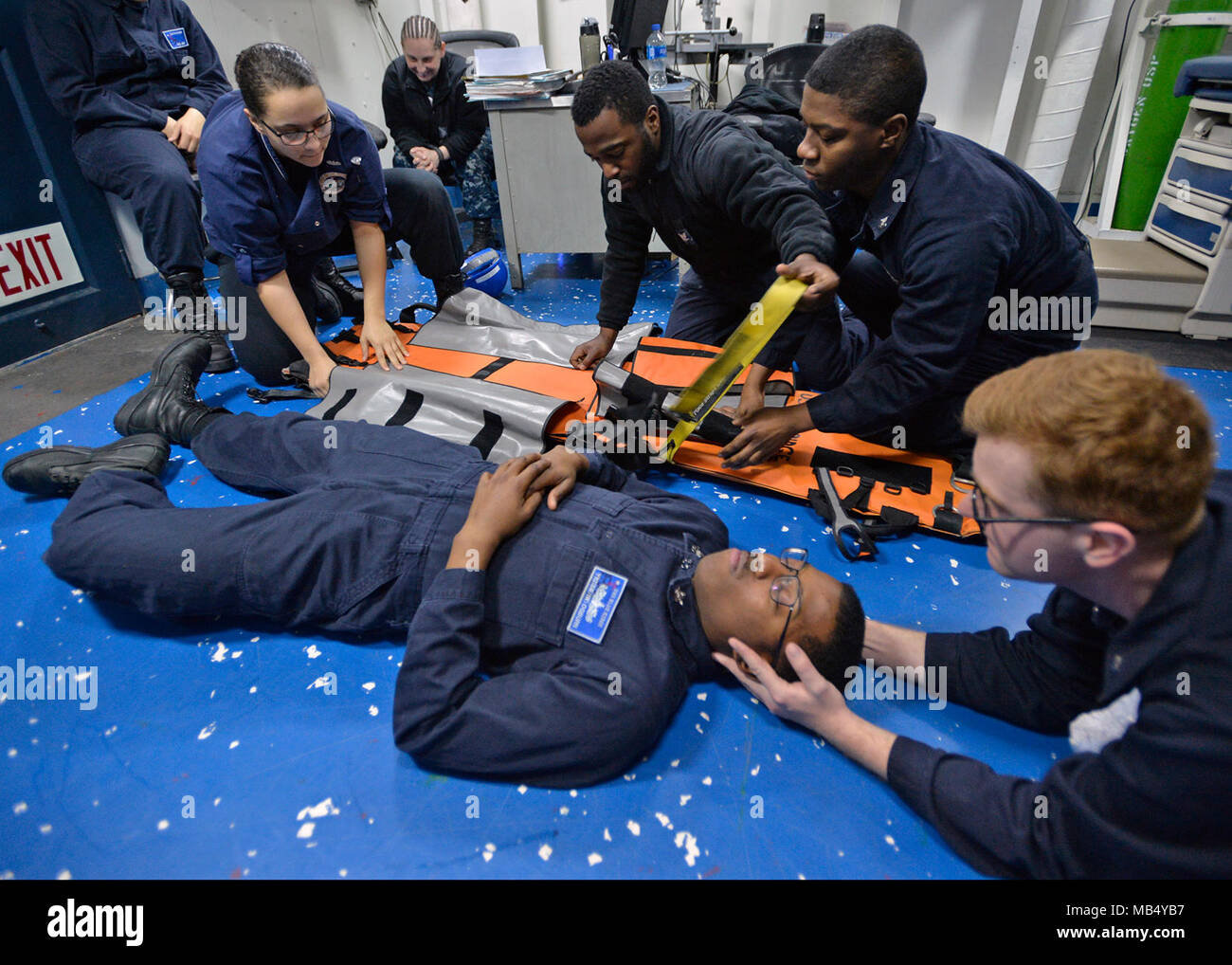 YOKOSUKA, Japan (Feb. 20, 2018) Yeoman 2nd Class Jordan Ogburn, center ...