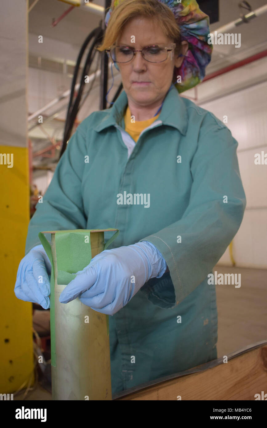 Crane Army Ammunition Activity employees disassemble 76 mm white ...