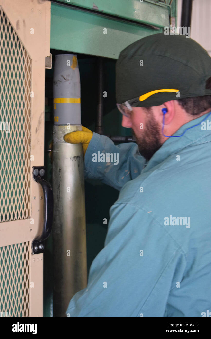 Crane Army Ammunition Activity employees disassemble 76 mm white ...
