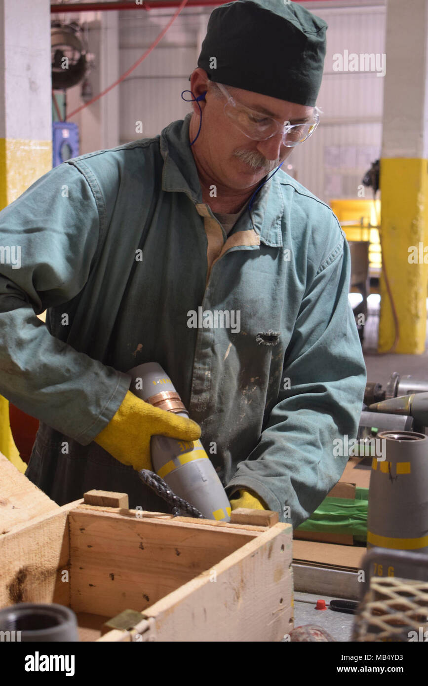 Crane Army Ammunition Activity employees disassemble 76 mm white ...