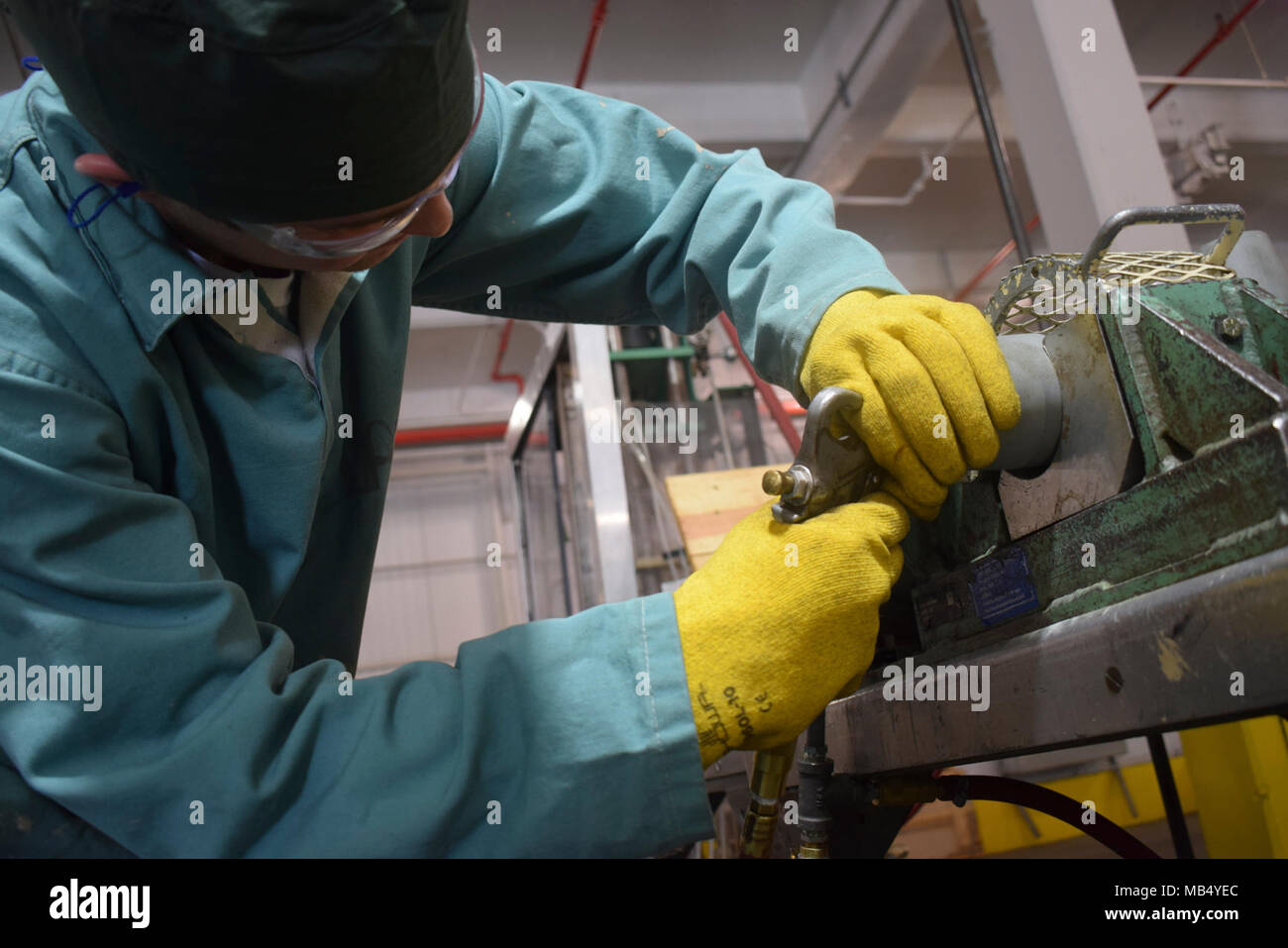 Crane Army Ammunition Activity employees disassemble 76 mm white ...