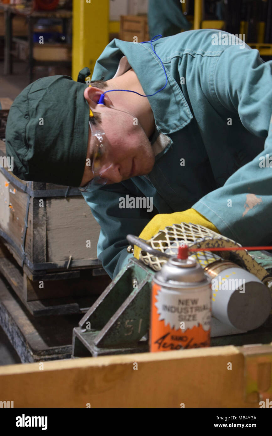 Crane Army Ammunition Activity employees disassemble 76 mm white ...