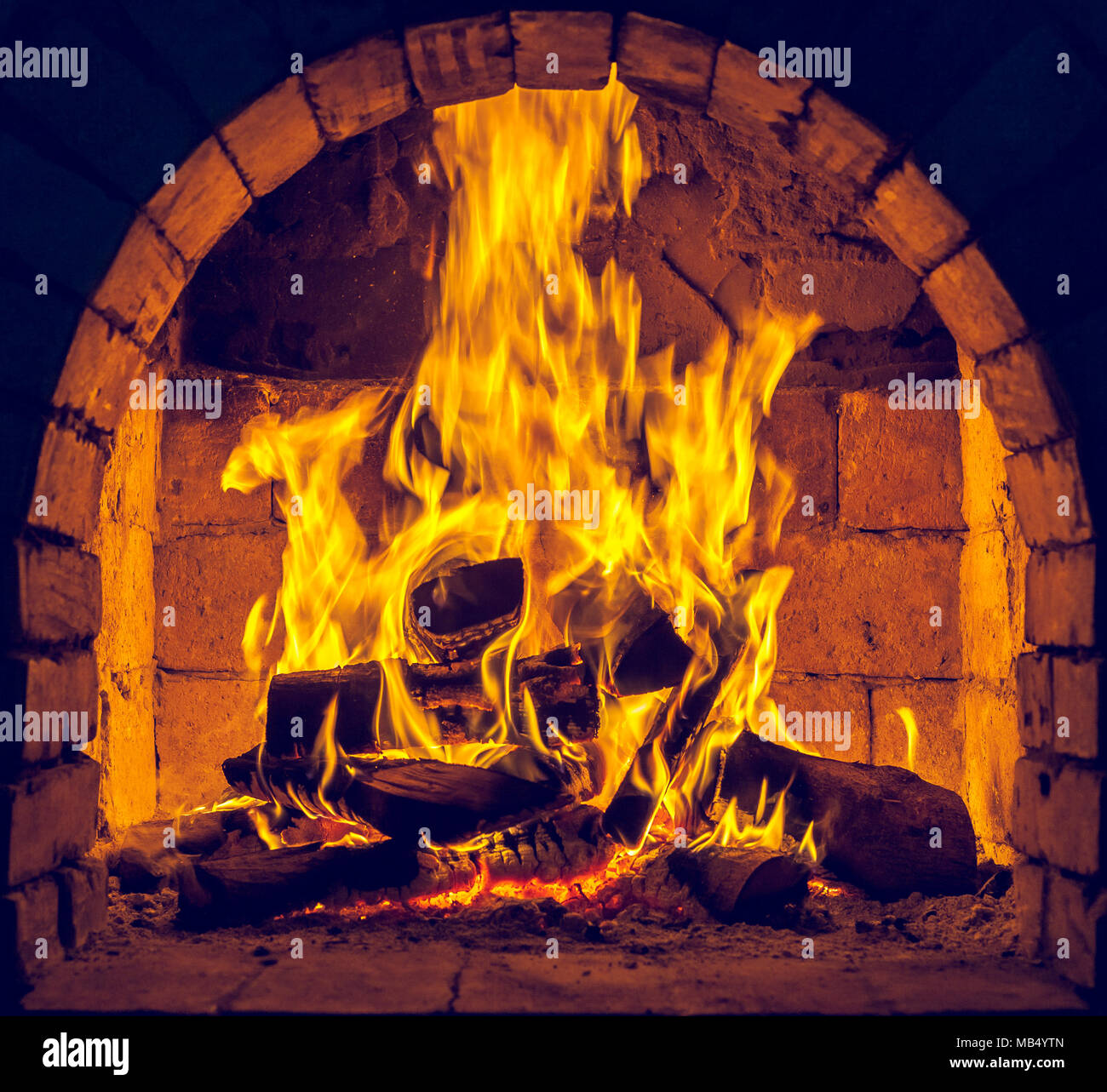 A fire burns in a fireplace Stock Photo - Alamy