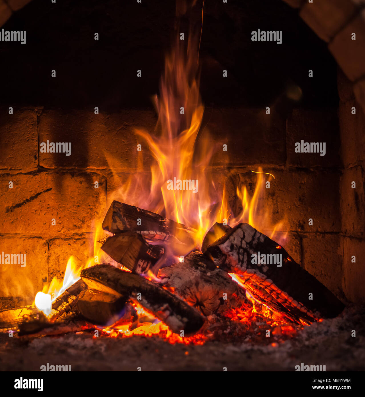 A fire burns in a fireplace Stock Photo - Alamy