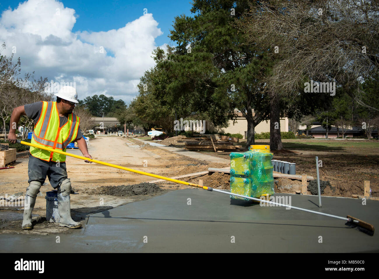 Juan Zaragoza, construction concrete finisher, smooths out cement ...