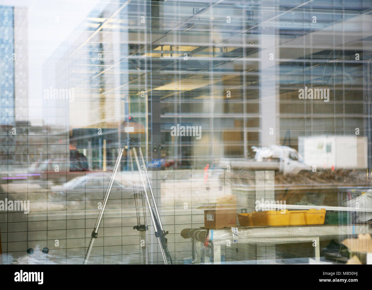 Reflex glass building construction site with tripod and helmet Stock ...