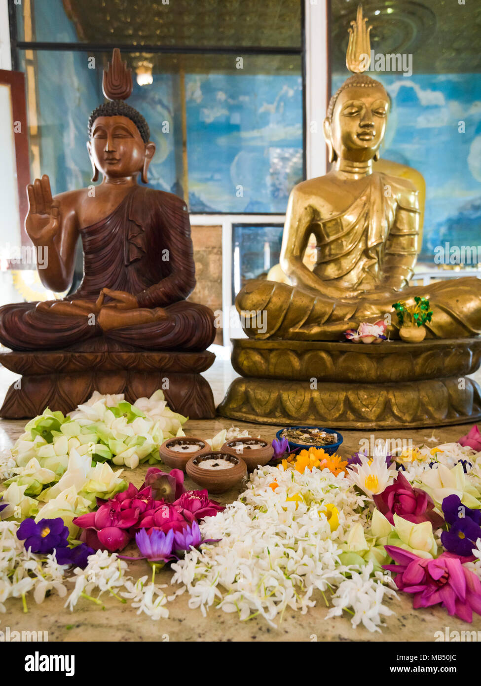 Vertical close up of flowers at the altar in Jaya Sri Maha Bodhi in ...