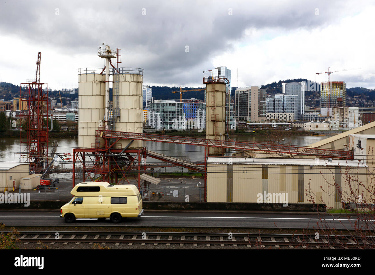 An RV camper van on N Interstate Ave passes by industrial businesses ...