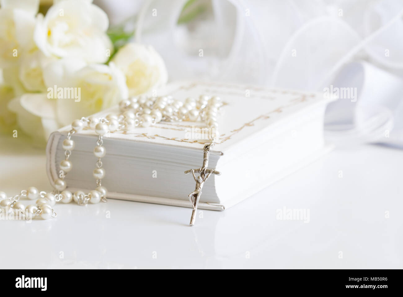 First holy communion symbol background concept with rosary and flowers ...