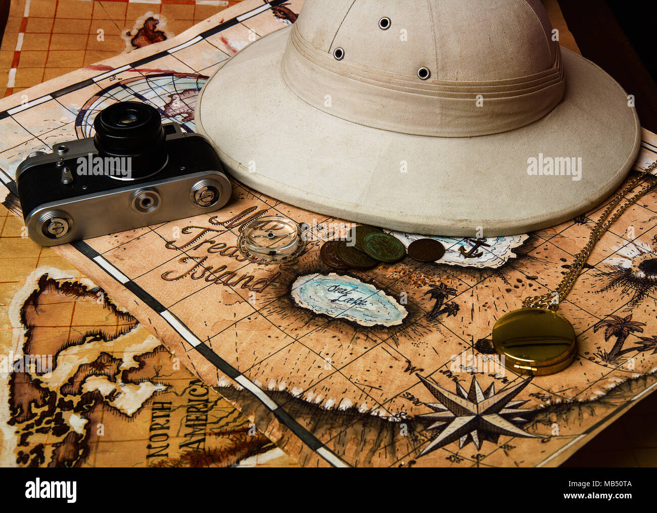 pith helmet and maps Stock Photo - Alamy