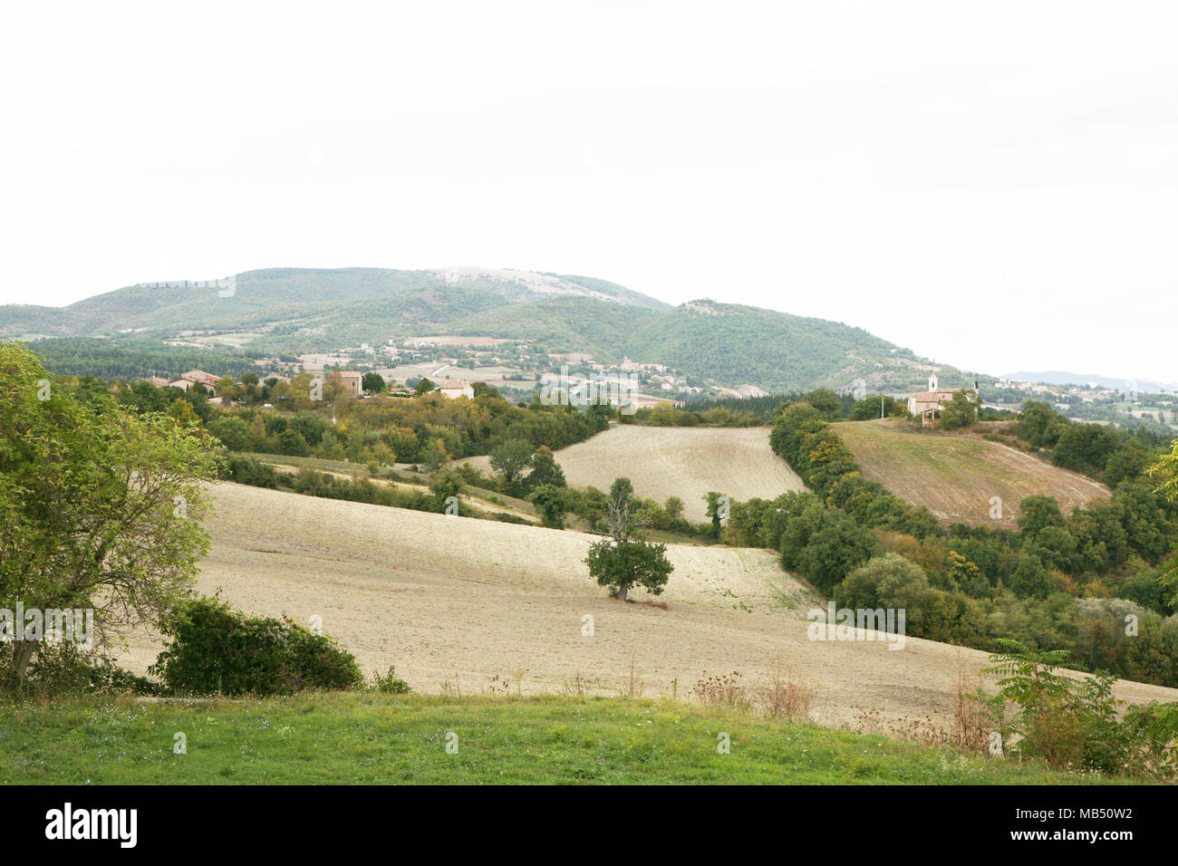 Hills of Marche countryside and small church in the landscape, Italy ...
