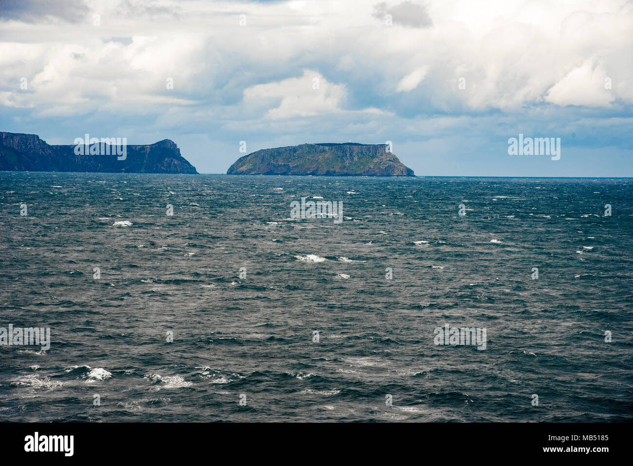 Scenic view of Tasman sea from a boat, cloudy sky in background. Storm ...