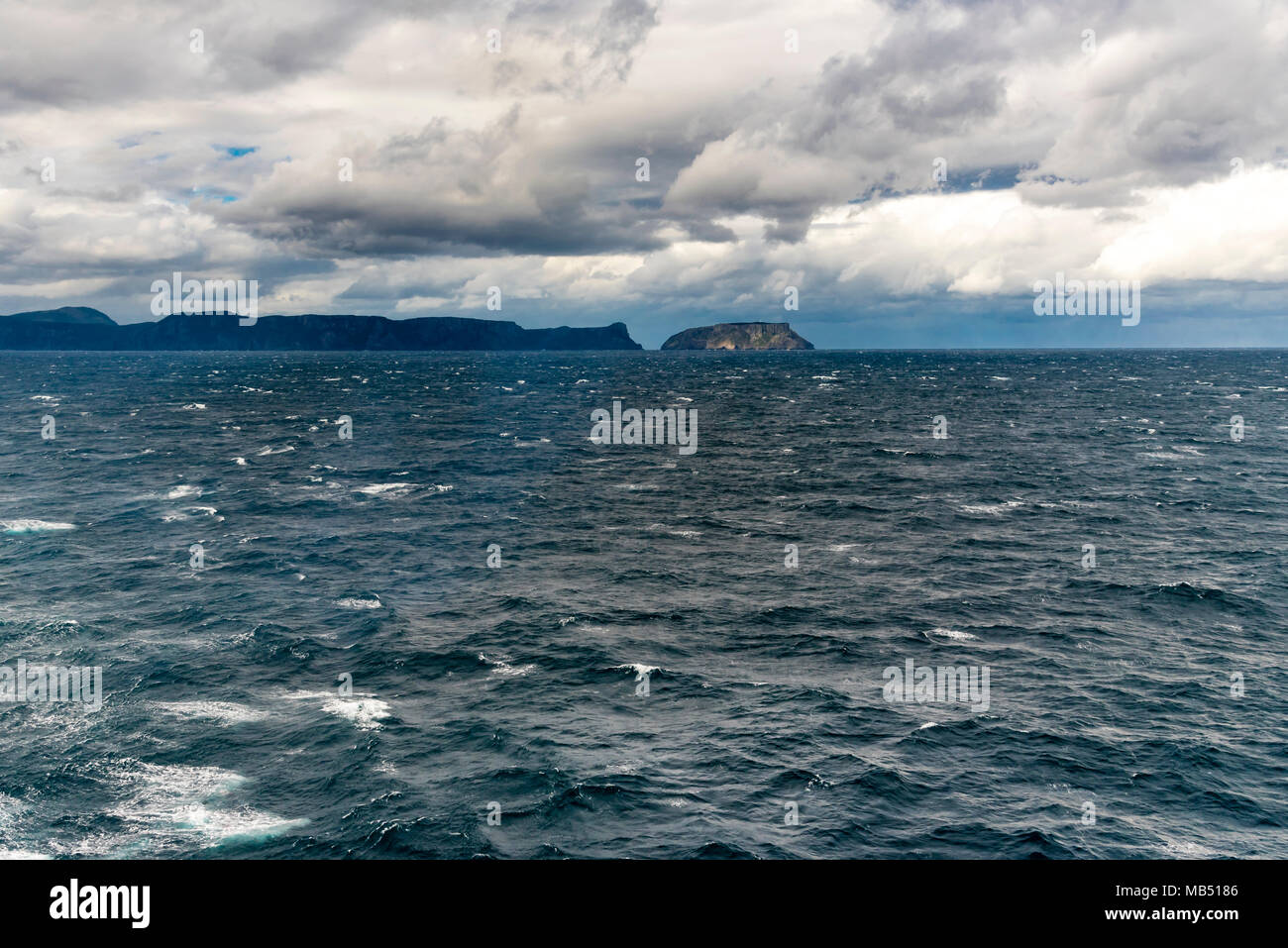 Scenic view of Tasman sea from a boat, cloudy sky in background. Storm ...