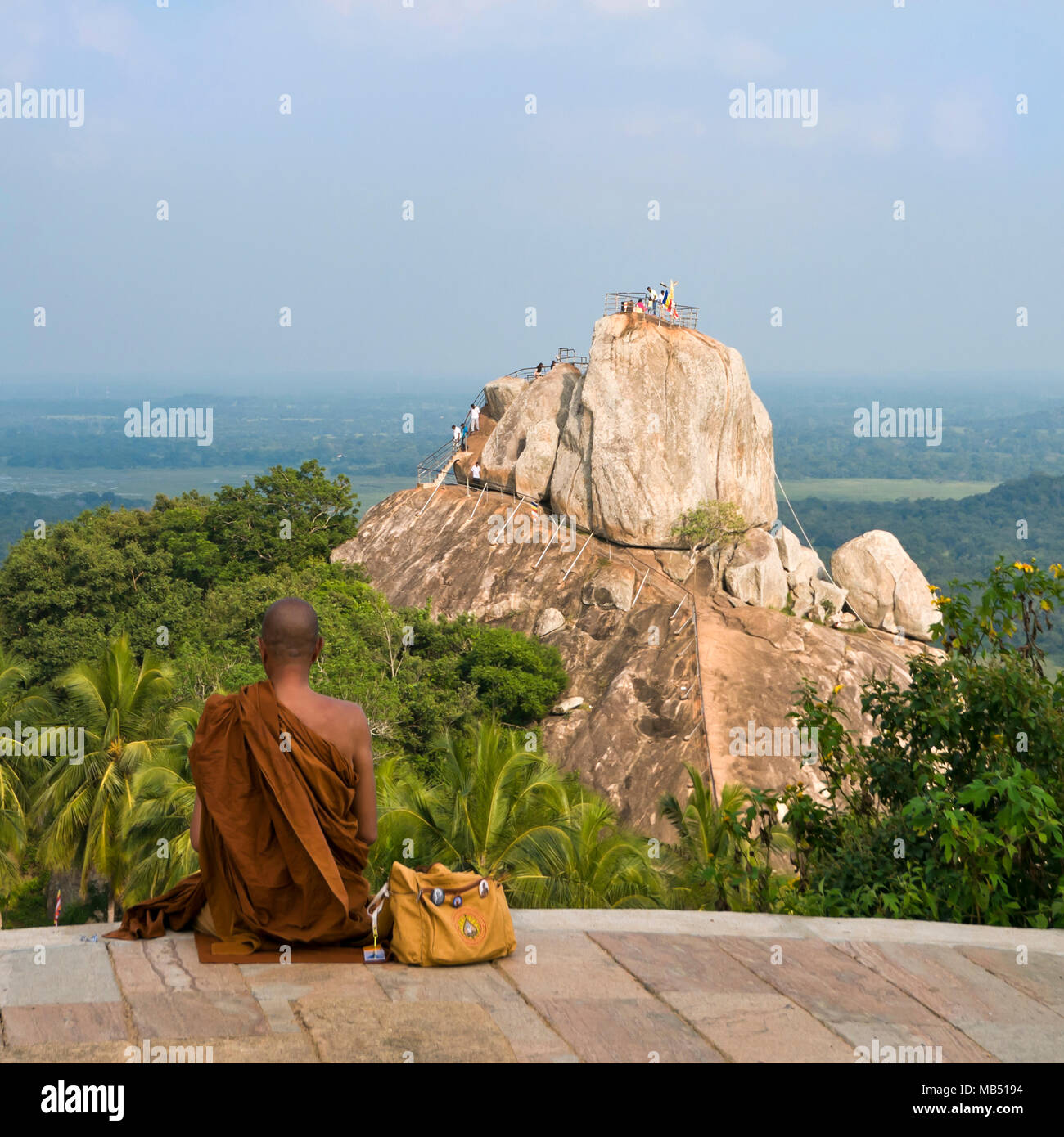 Square portrait of a monk at the pilgrimage site Aradhana Gala rock at ...