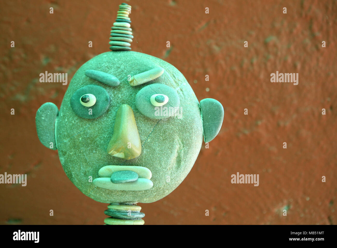 Stone idol head Stock Photo - Alamy