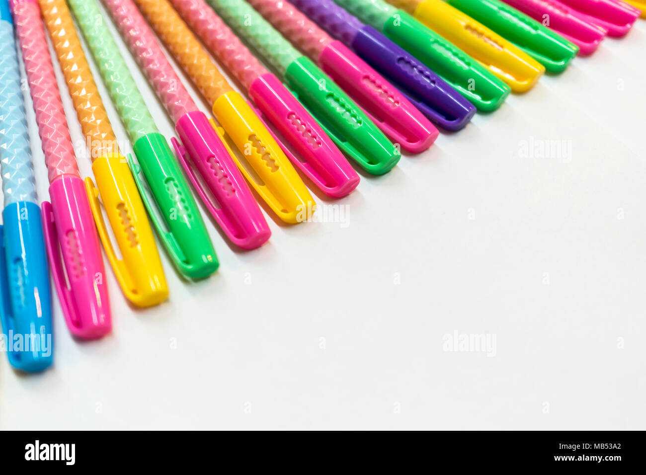 A pencil case, pens, pencils, notebook, notebooks lie on the table ...