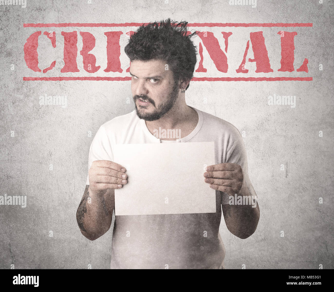 Caught gangster with criminal background Stock Photo - Alamy