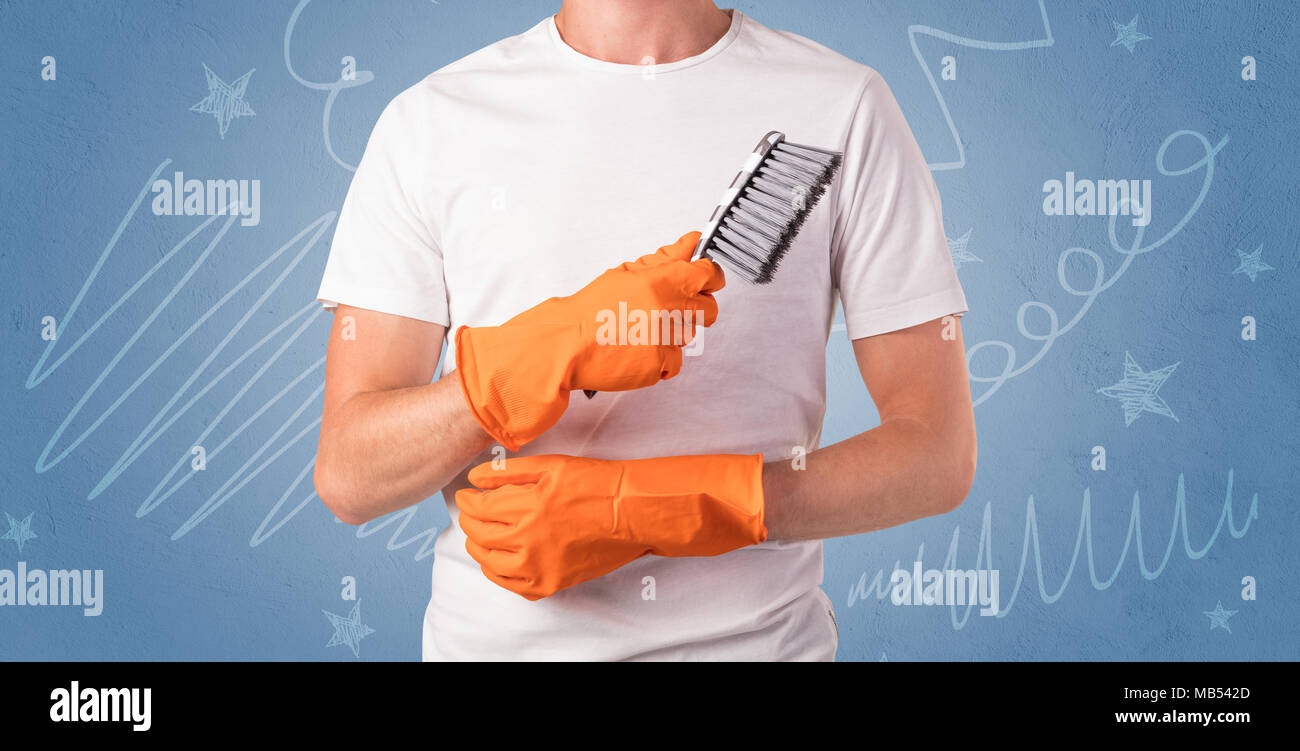Swabber with orange rubber gloves and doodle concept on wallpaper Stock ...