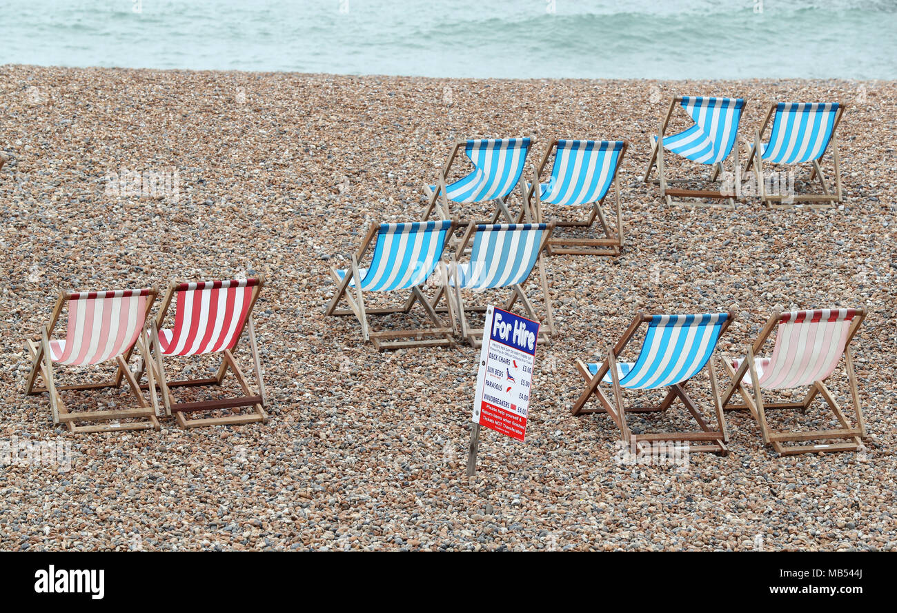Empty deck chairs sit on Brighton beach this morning Stock Photo - Alamy