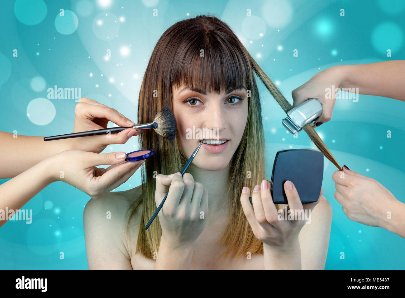 Graceful brunette woman getting ready with shiny turquoise wallpaper ...