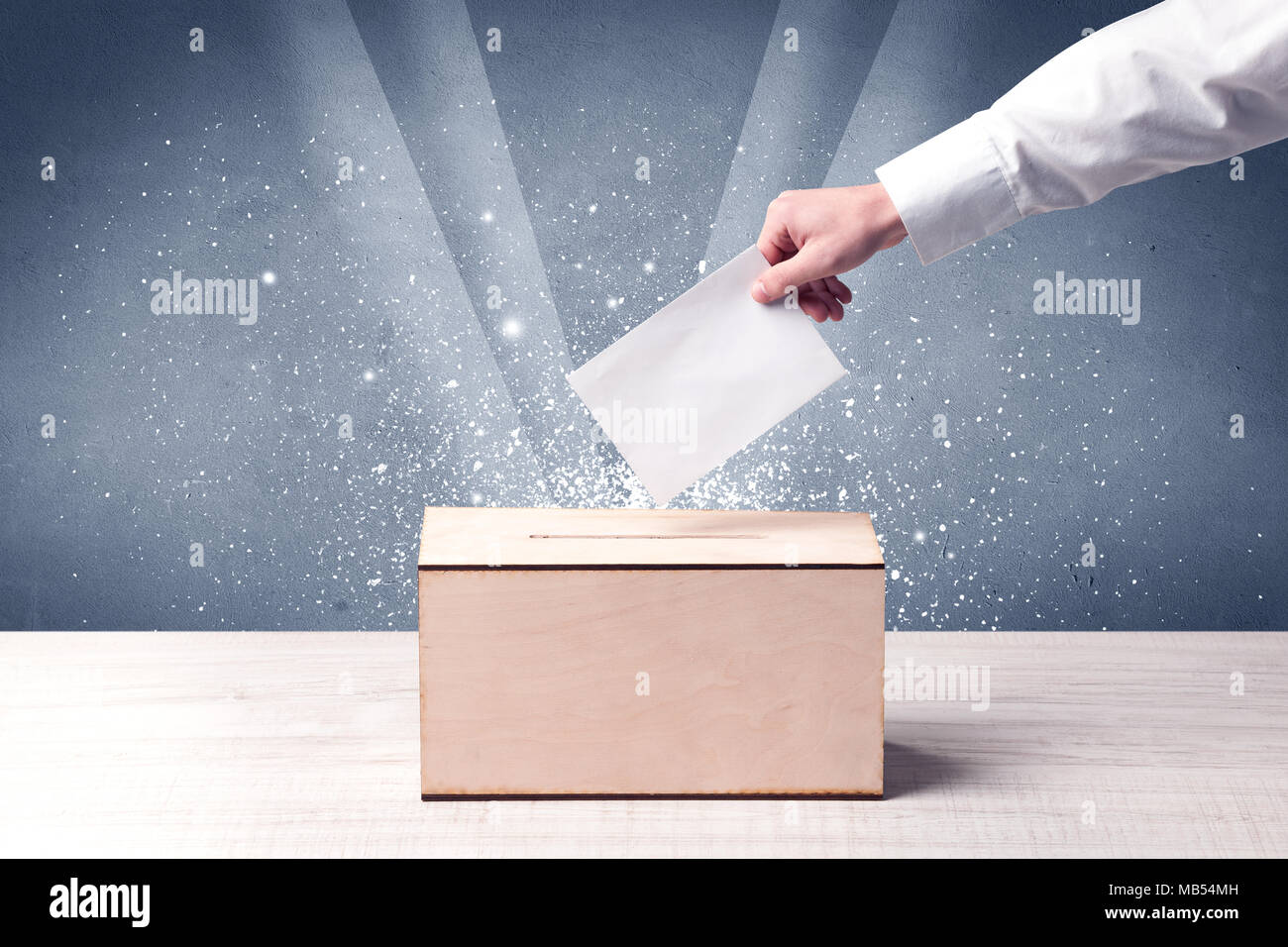 Ballot box with person casting vote on sparkling background Stock Photo ...