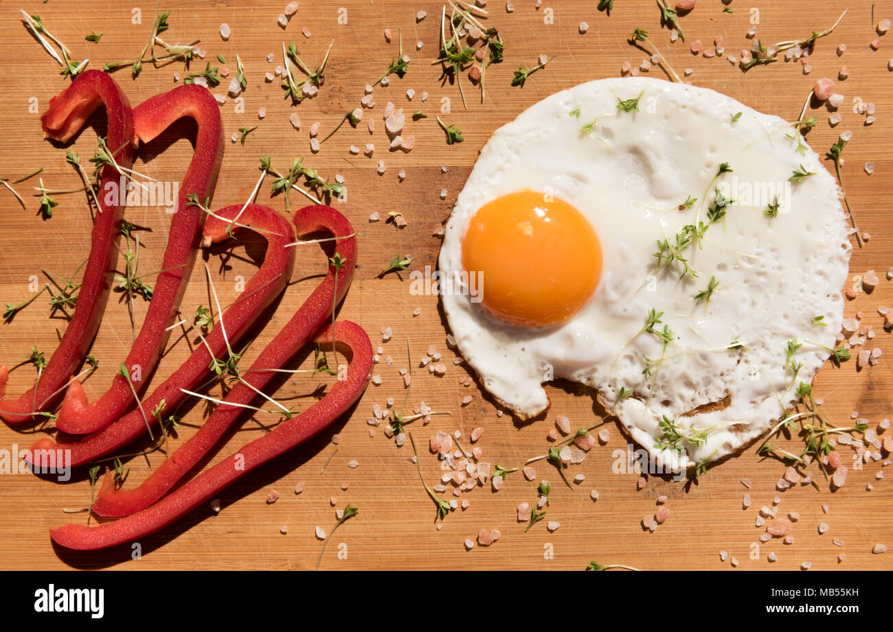 fried egg on a drained background Stock Photo - Alamy