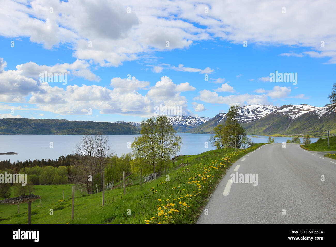 Picturesque spring Norway landscape with asphalt road in mountains near ...