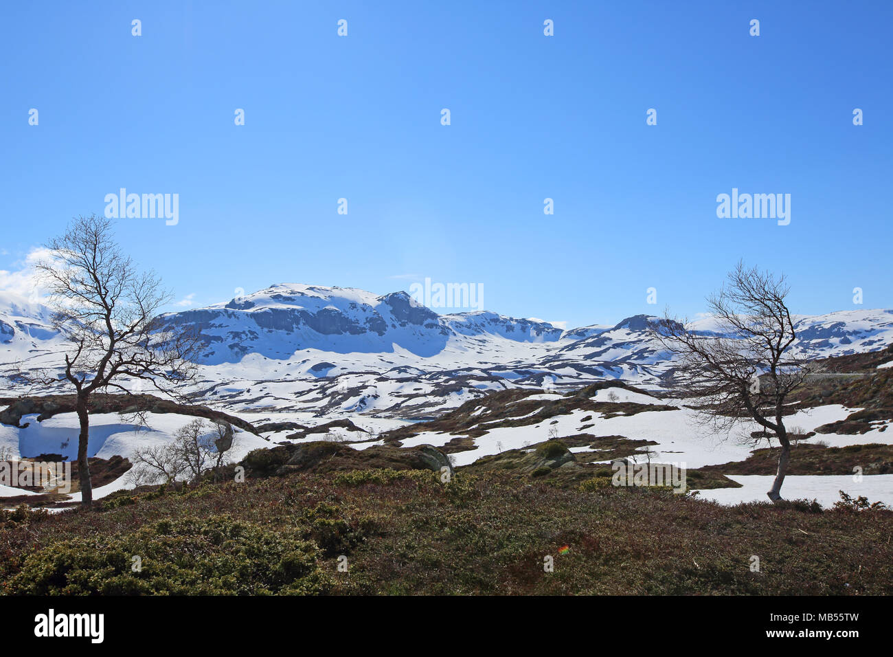 Spring valley landscape with mountains and melting snow, Norway Stock ...