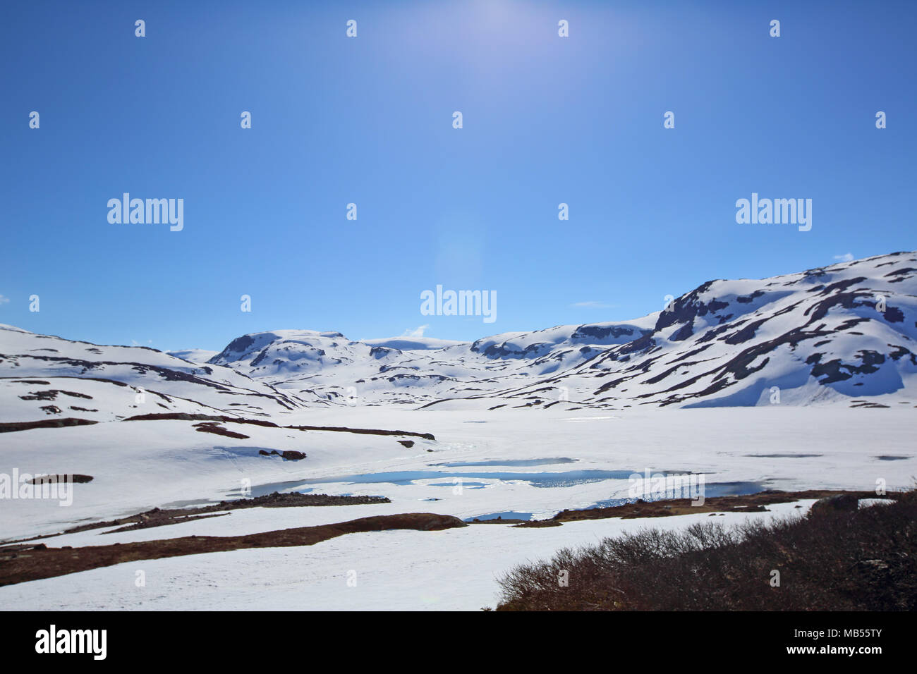 Spring valley landscape with mountains and melting snow, Norway Stock ...