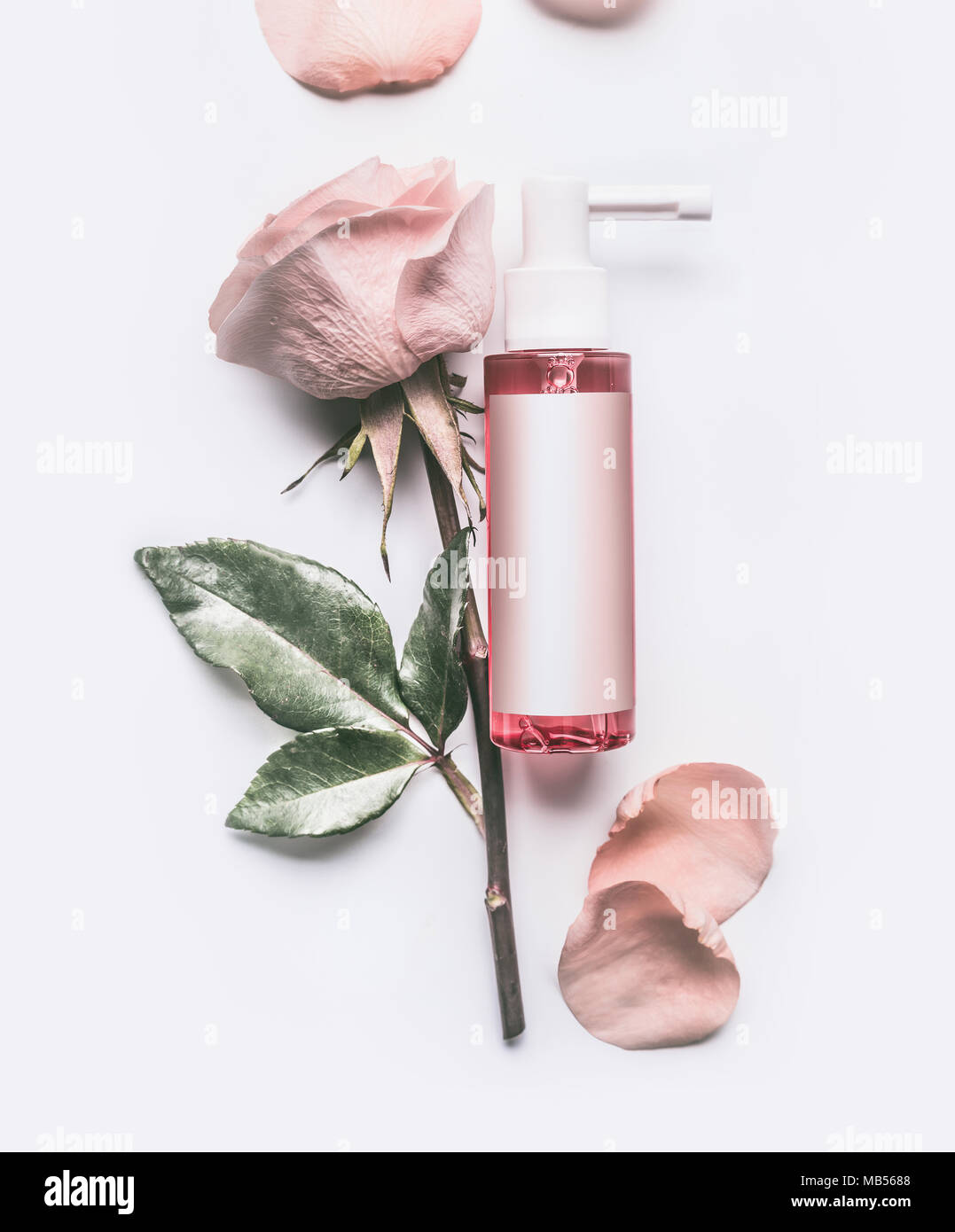 Pink Roses essential cosmetic product bottle with branding mock up and ...
