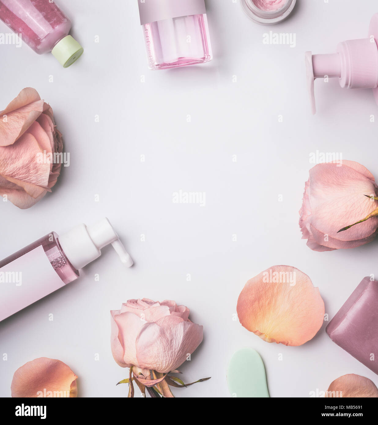 Roses cosmetics frame with toner,serum, essence,moisturizer and others ...