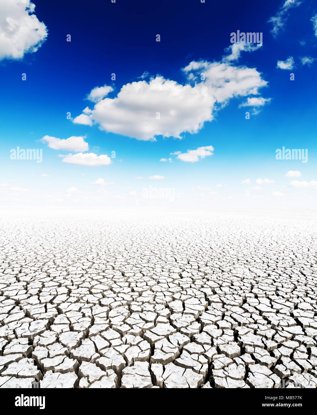 drought earth and blue sky with clouds Stock Photo - Alamy