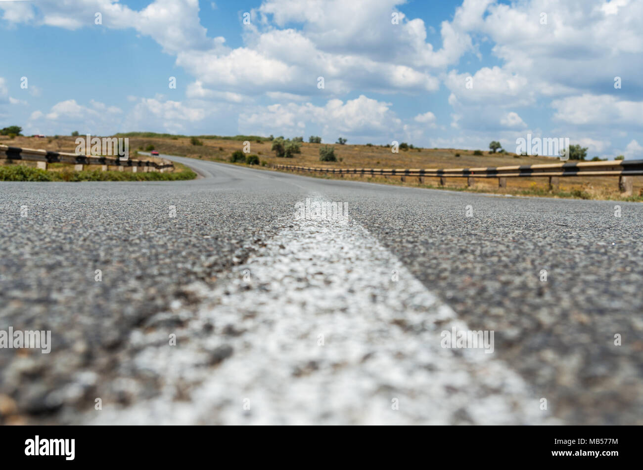 asphalt road closeup with center white line. soft focus Stock Photo - Alamy