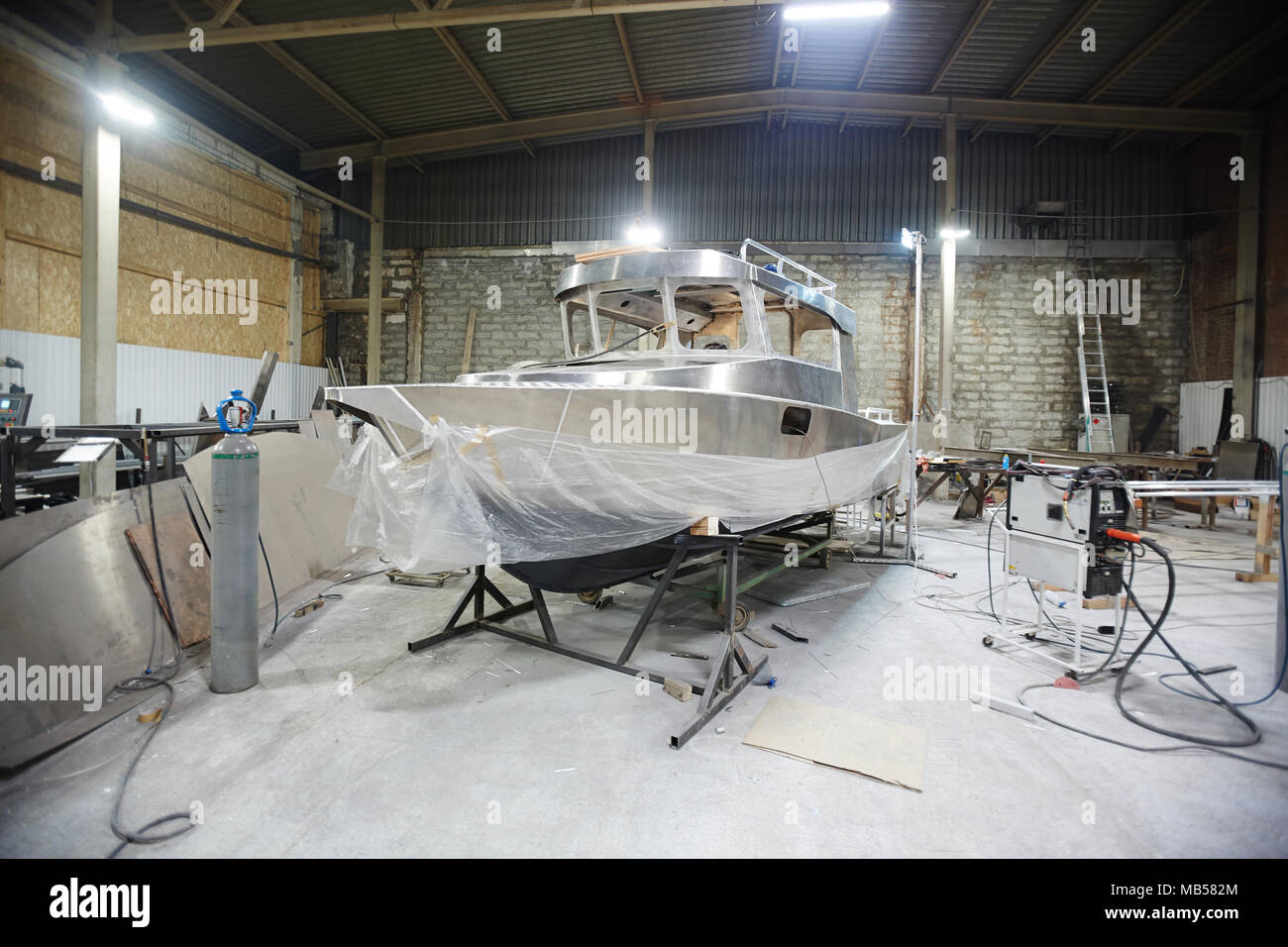 Large industrial hangar or modern ship production factory with new ...