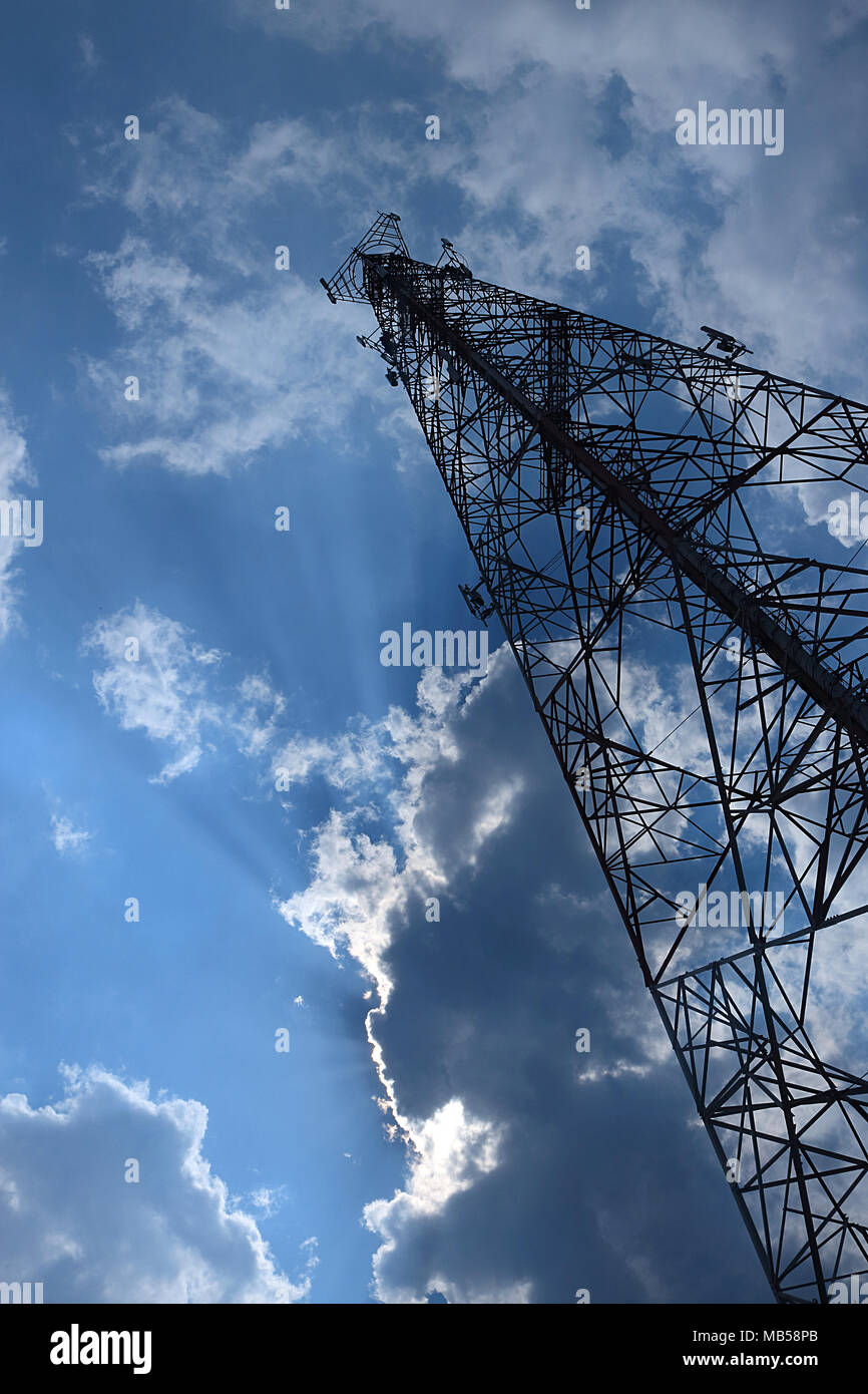 This ground-level photograph depicts the intricate steel framework of a ...