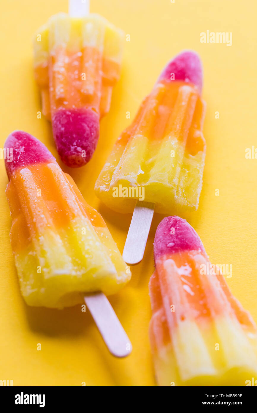 Rocket shaped summer ice lolly on a bright yellow background Stock ...