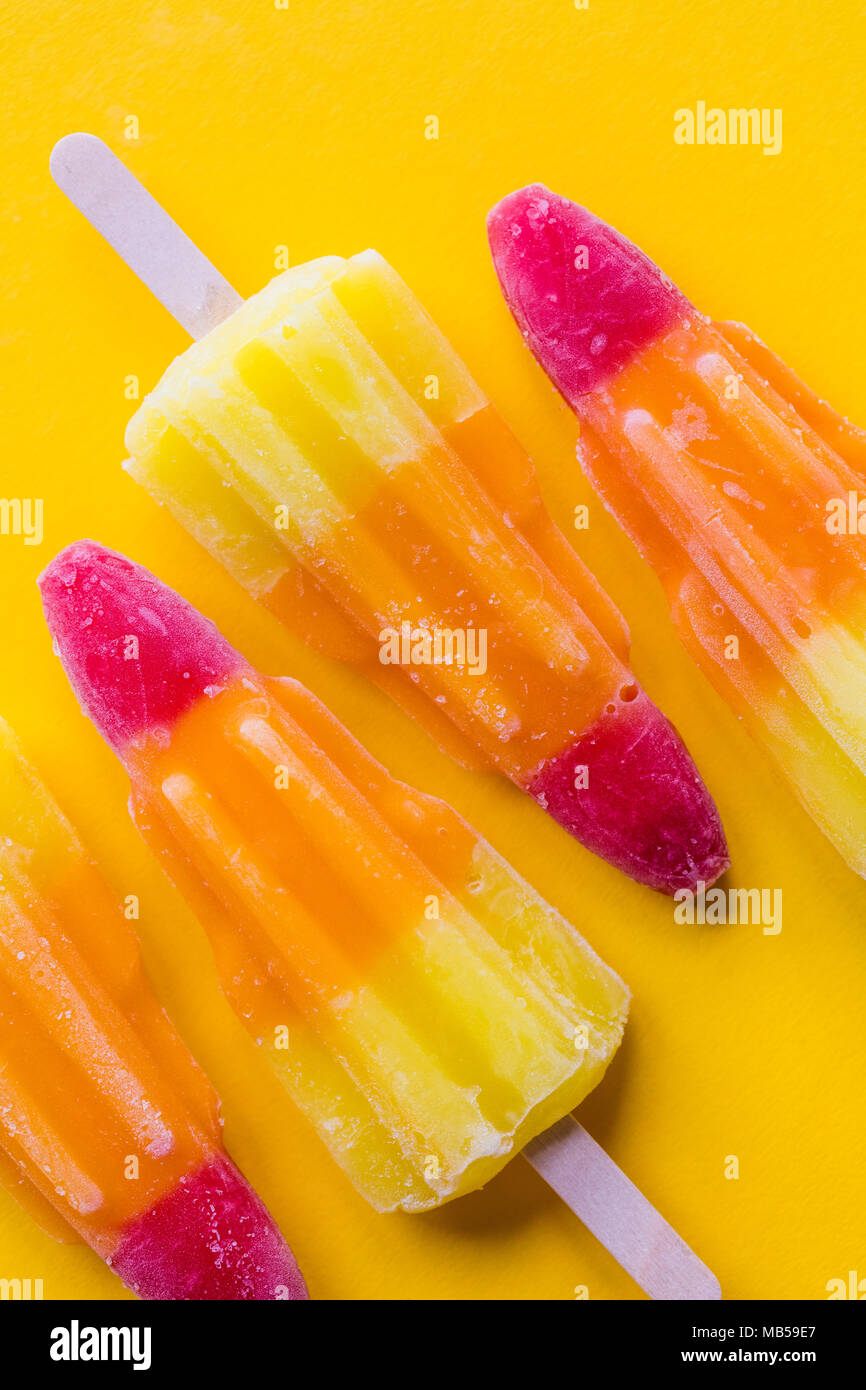 Rocket shaped summer ice lolly on a bright yellow background Stock ...