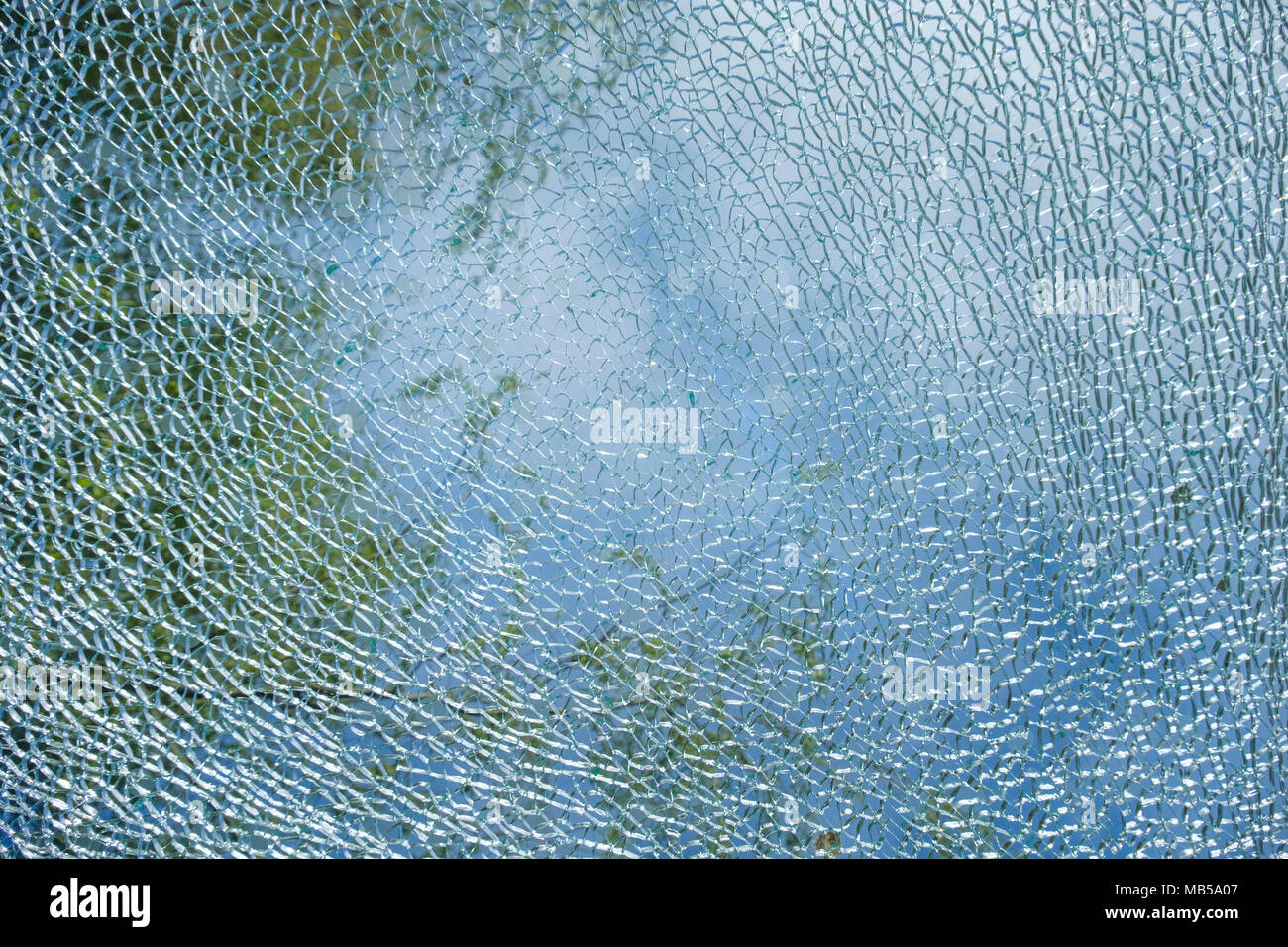 Shattered damaged pieces blue glass hi-res stock photography and images ...