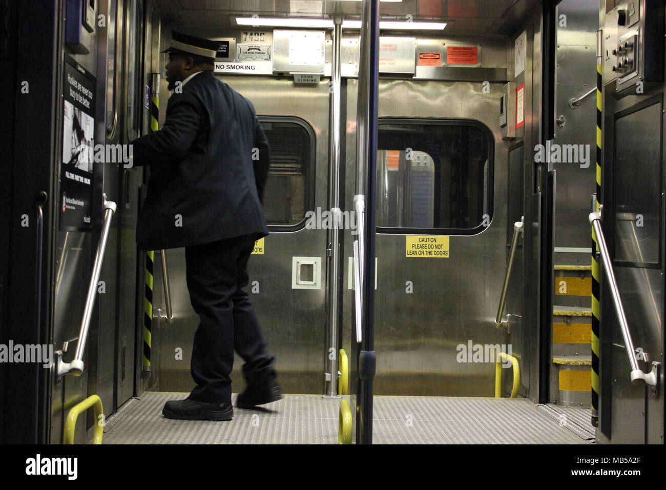 Chicago's Metra commuter train conductor making inspection in the cab ...