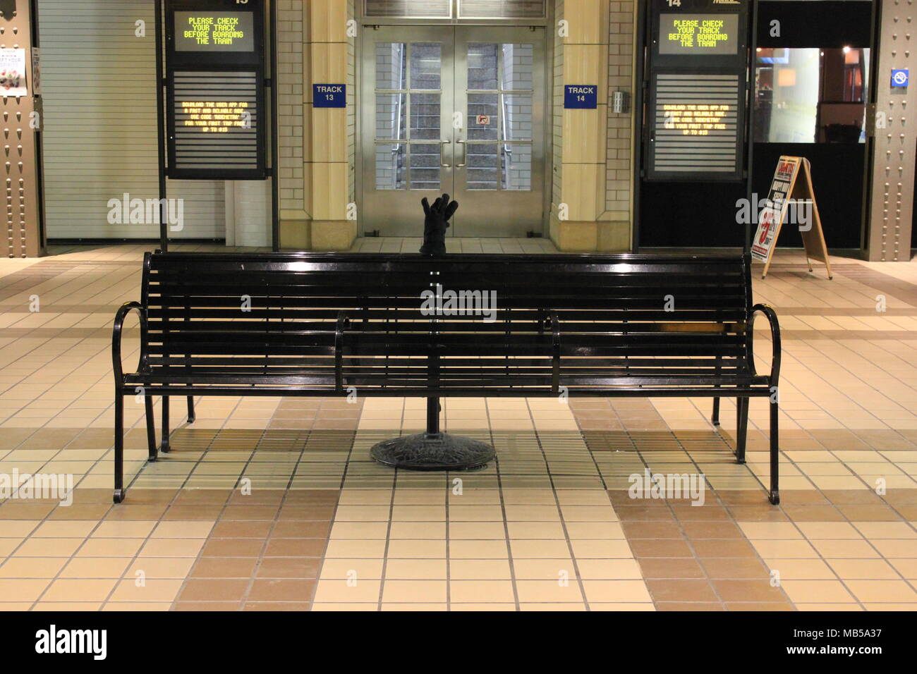 Bench with a lone glove on the lower level concourse of Chicago's ...