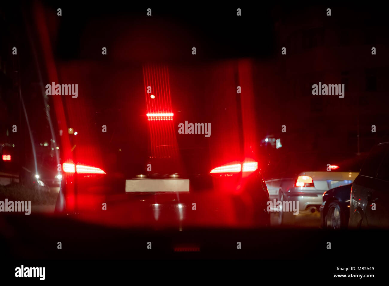 The traffic jam on the road in the city at the night with yellow and ...