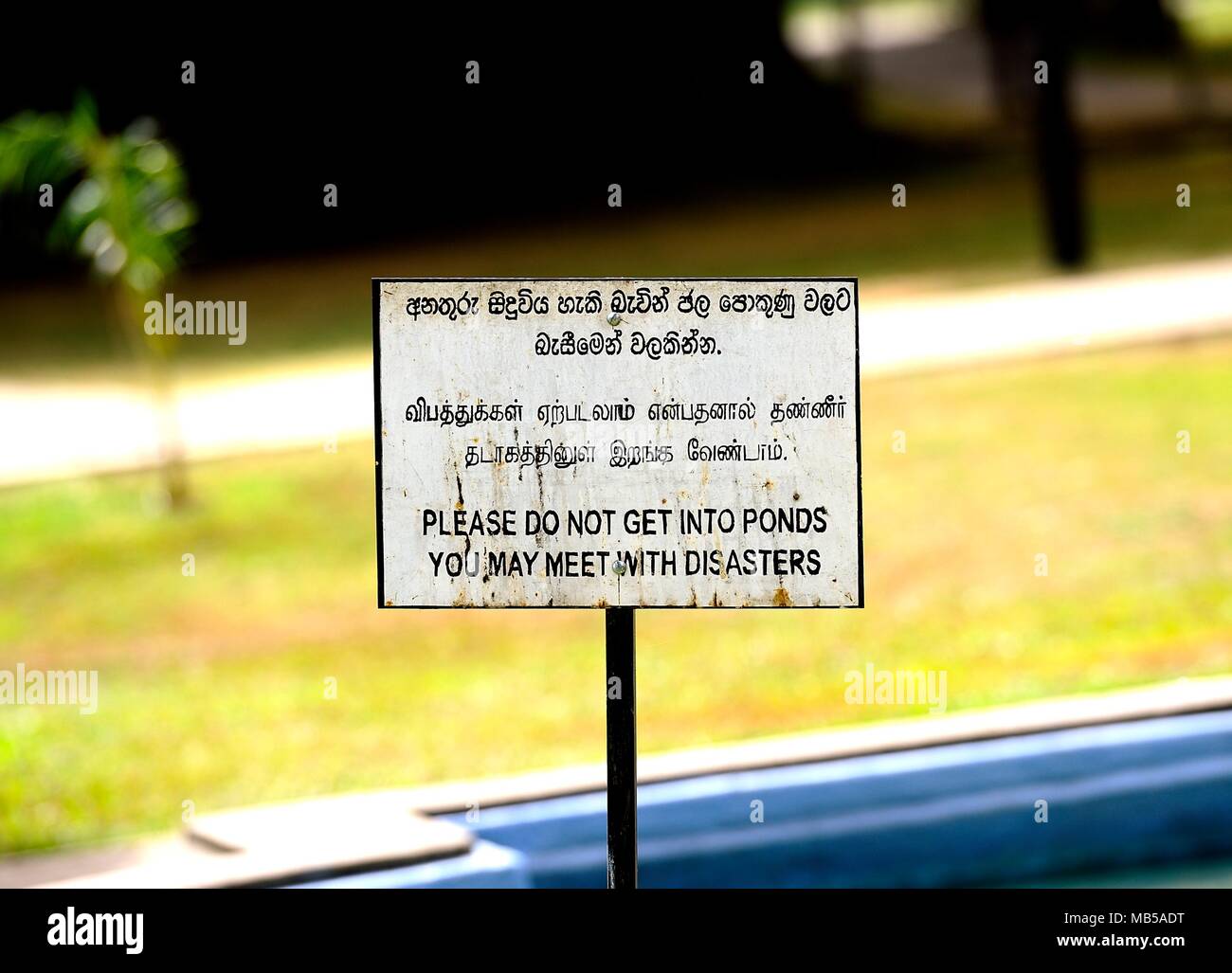 Colombo, Sri Lanka - January 2017 - Warning sign in three languages ...