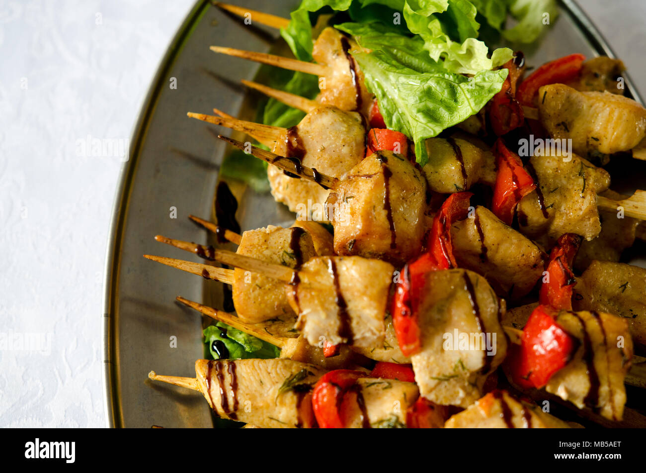 Roast Chicken filet kebab on bamboo sticks Stock Photo - Alamy