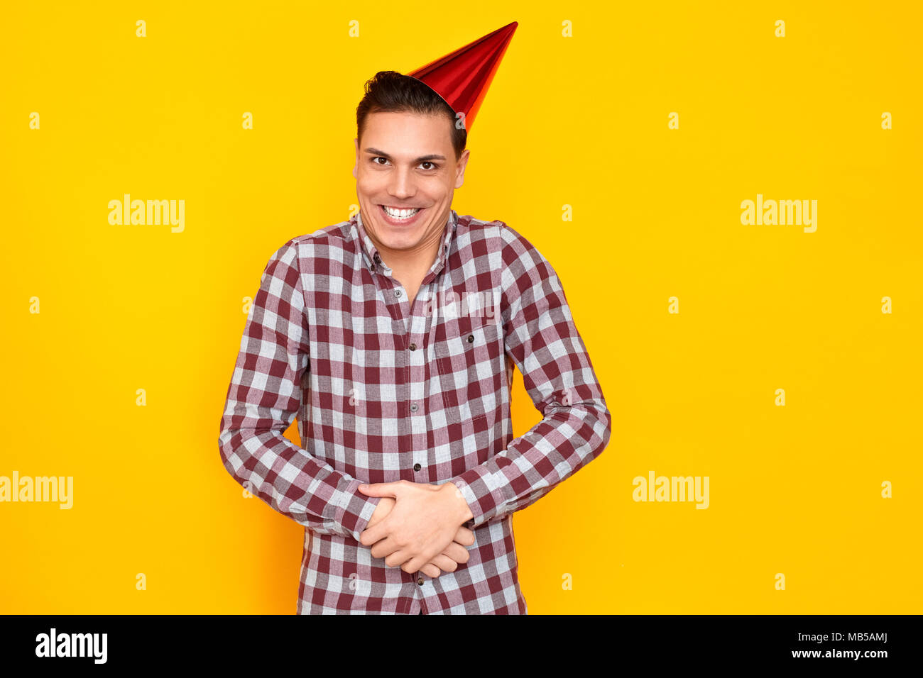 Stupid man wearing hubcap toothy smiling at camera . Fool's day ...