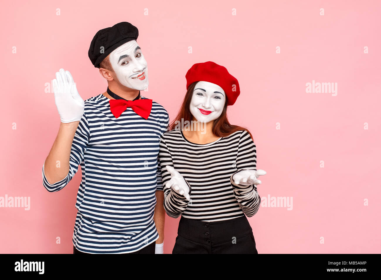 Welcome my friend! Happiness couple smiling and showing hello sign ...